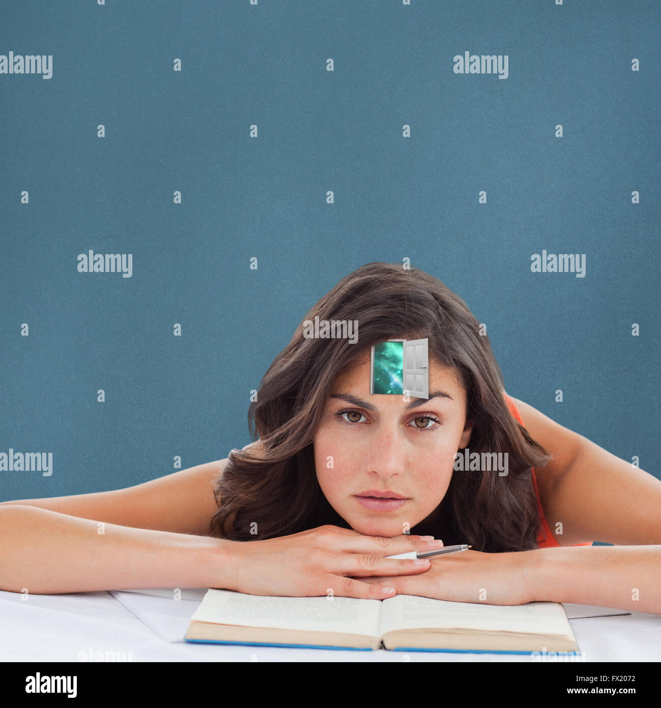 Composite image of frowning student head on her books Stock Photo - Alamy