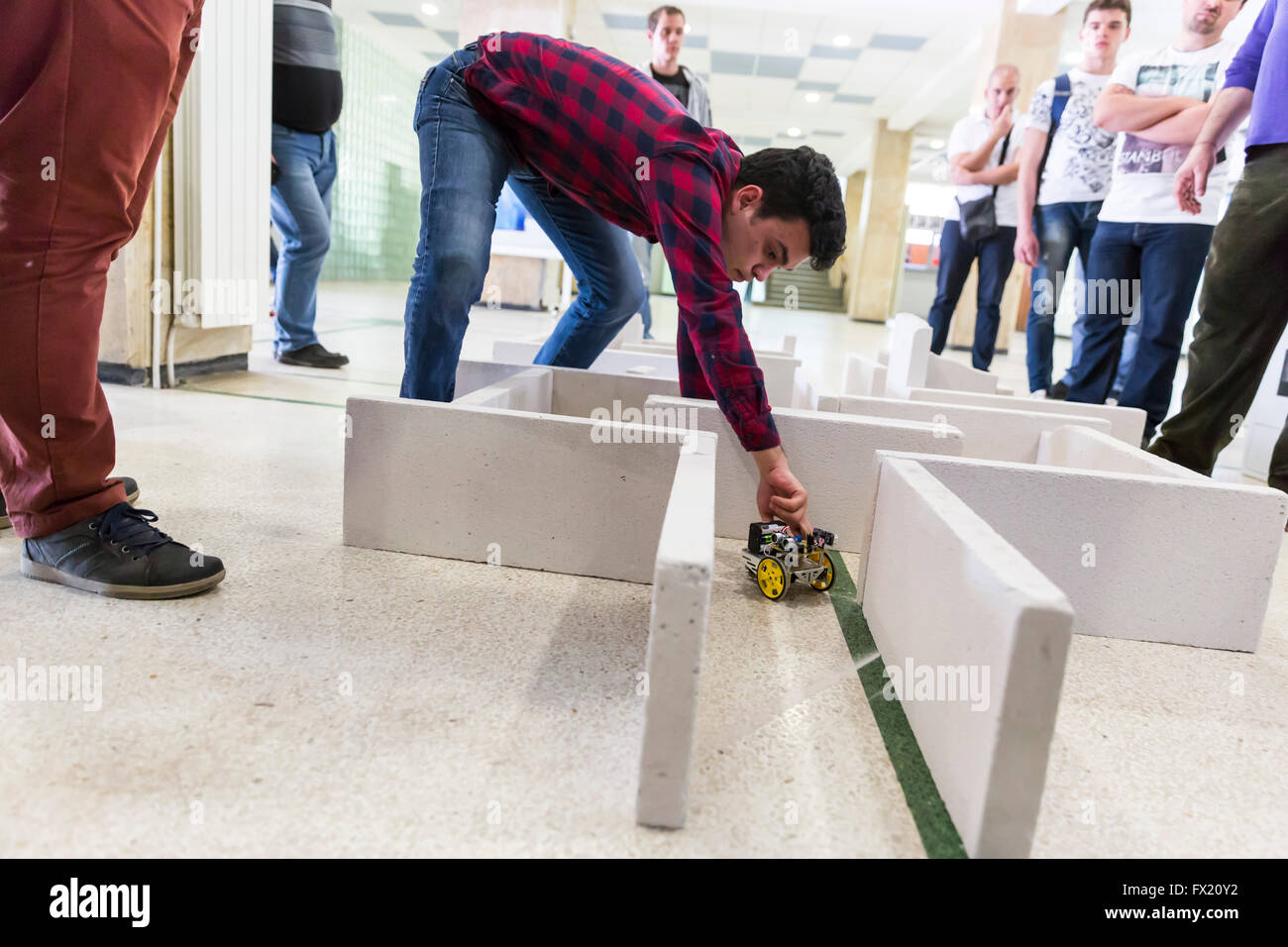 Sofia, Bulgaria - April 5, 2016: A student is helping his self-made ...