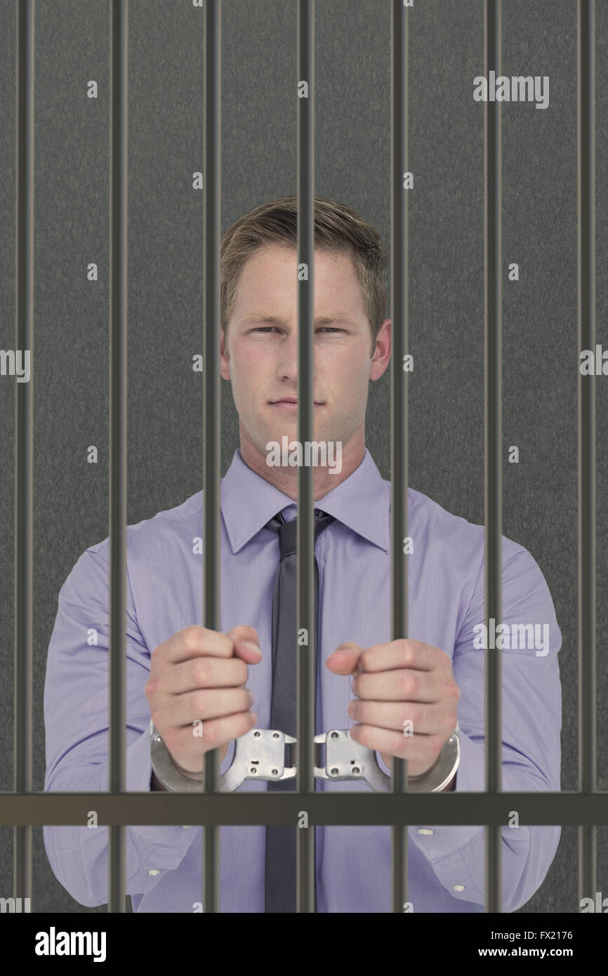 Composite image of handsome businessman wearing handcuffs Stock Photo ...