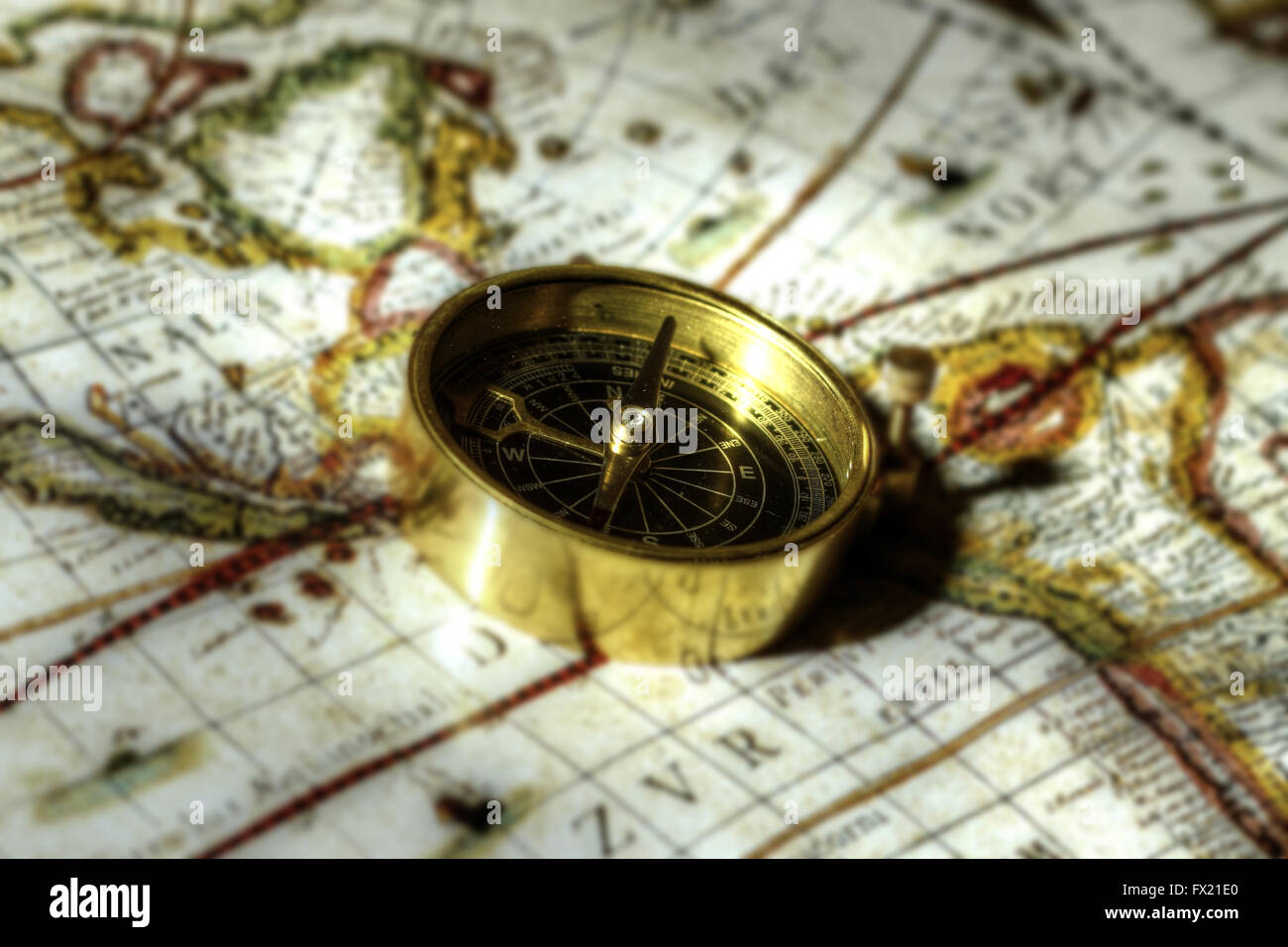 Antique brass compass on map hi-res stock photography and images - Alamy