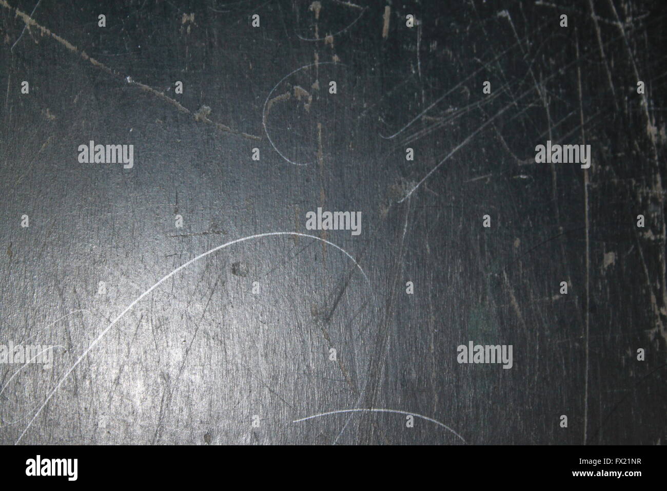 Light on a heavily scratched slate blackboard Stock Photo - Alamy