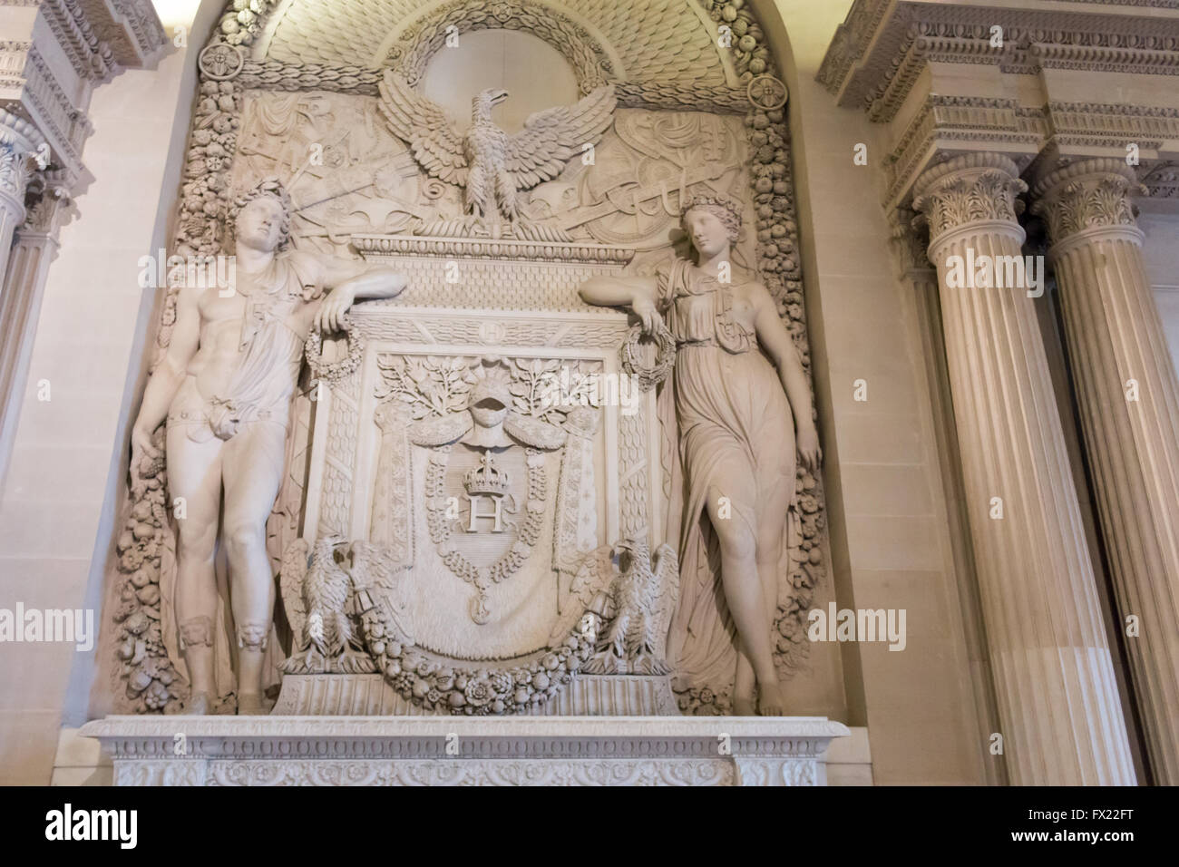 Classic-style wall relief in Sully Wing of Musee du Louvre. Monogram of ...