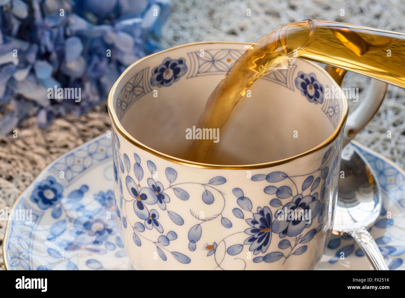 Pouring Tea into China Teacup Stock Photo - Alamy