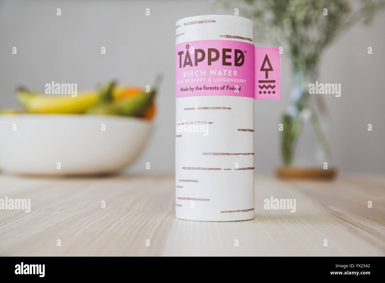 Tapped Birch water cartons on a wooden kitchen table in natural light ...