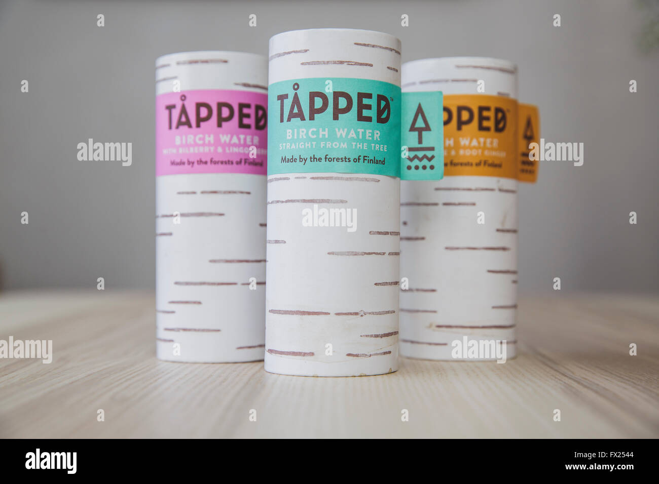 Tapped Birch water cartons on a wooden kitchen table in natural light ...