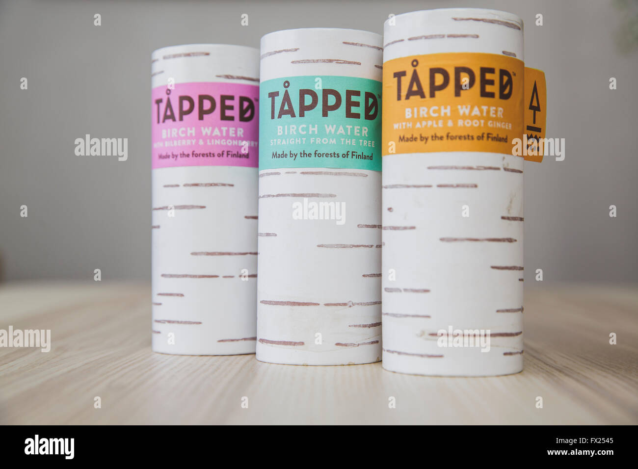 Tapped Birch water cartons on a wooden kitchen table in natural light ...