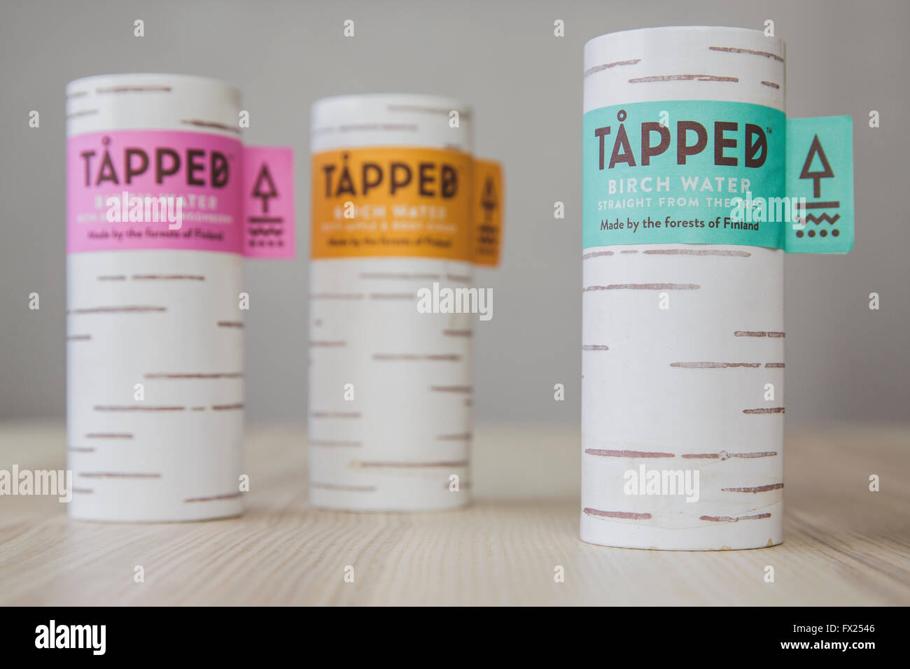 Tapped Birch water cartons on a wooden kitchen table in natural light ...