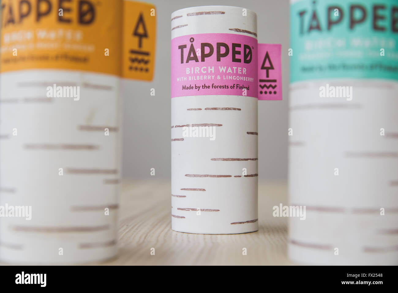 Tapped Birch water cartons on a wooden kitchen table in natural light ...