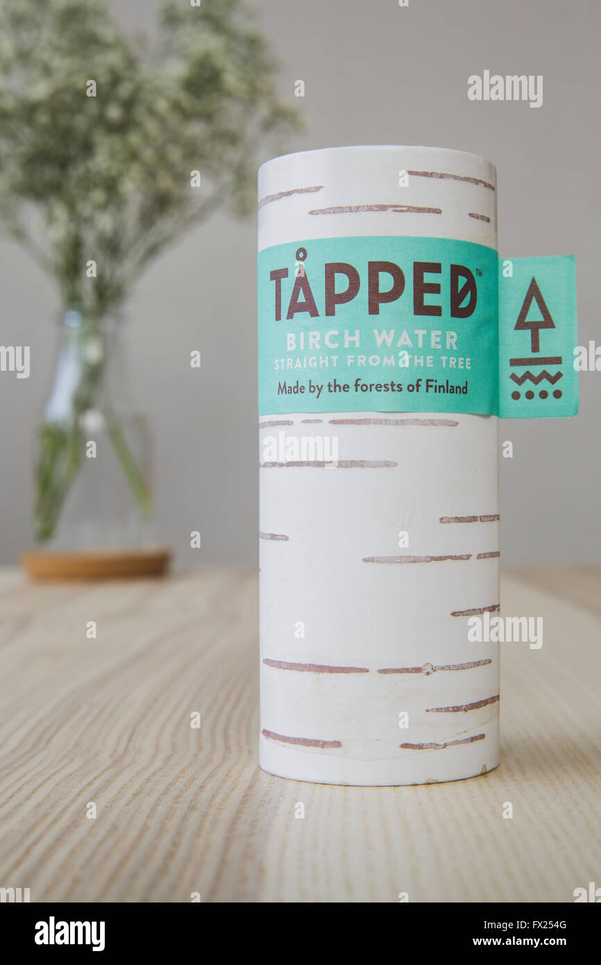 Tapped Birch water cartons on a wooden kitchen table in natural light ...