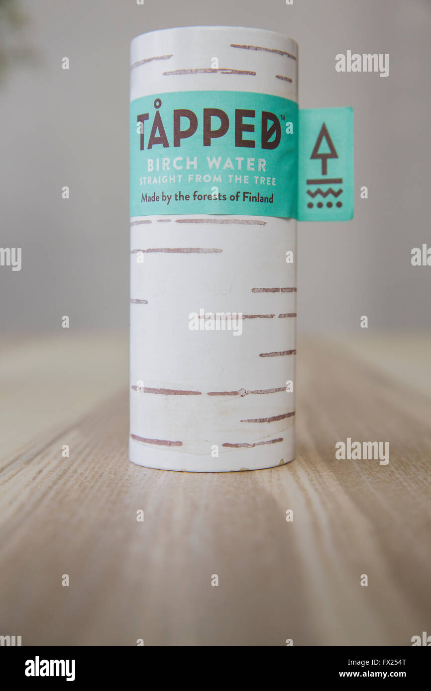 Tapped Birch water cartons on a wooden kitchen table in natural light ...