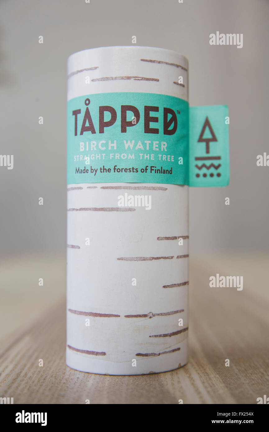 Tapped Birch water cartons on a wooden kitchen table in natural light ...