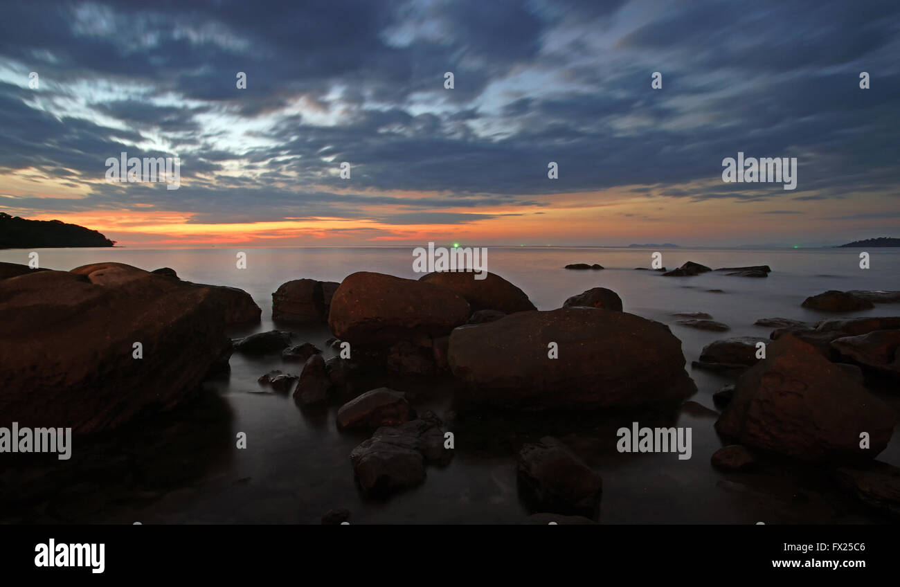 Rocks in sea shore calm hi-res stock photography and images - Alamy