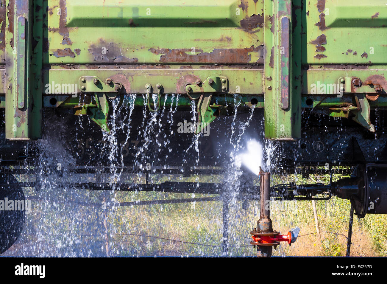 water washing of old freight railway cars Stock Photo - Alamy