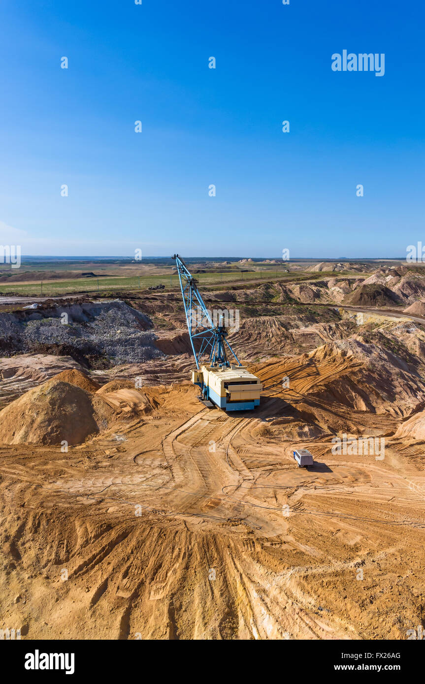 the big dipper dragline excavator digging clay on blue sky background ...