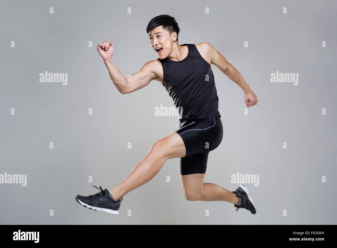 Male athlete running Stock Photo - Alamy