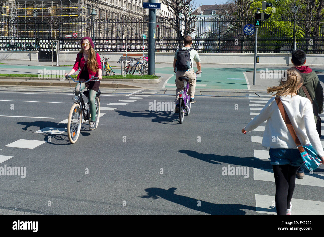 Pedestrians cyclists crossing road in hi-res stock photography and ...