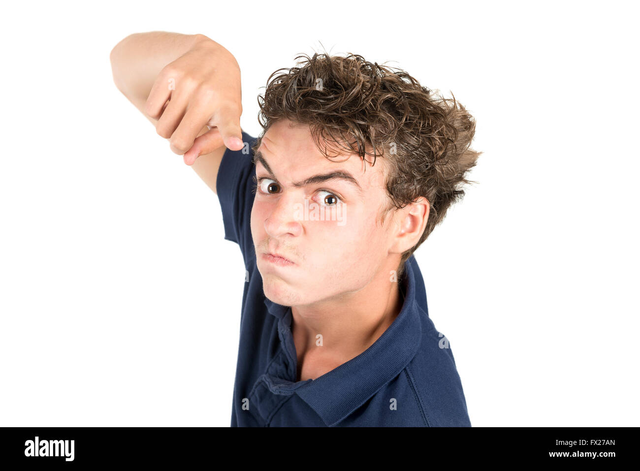 Angry teenage boy making faces isolated in white Stock Photo - Alamy