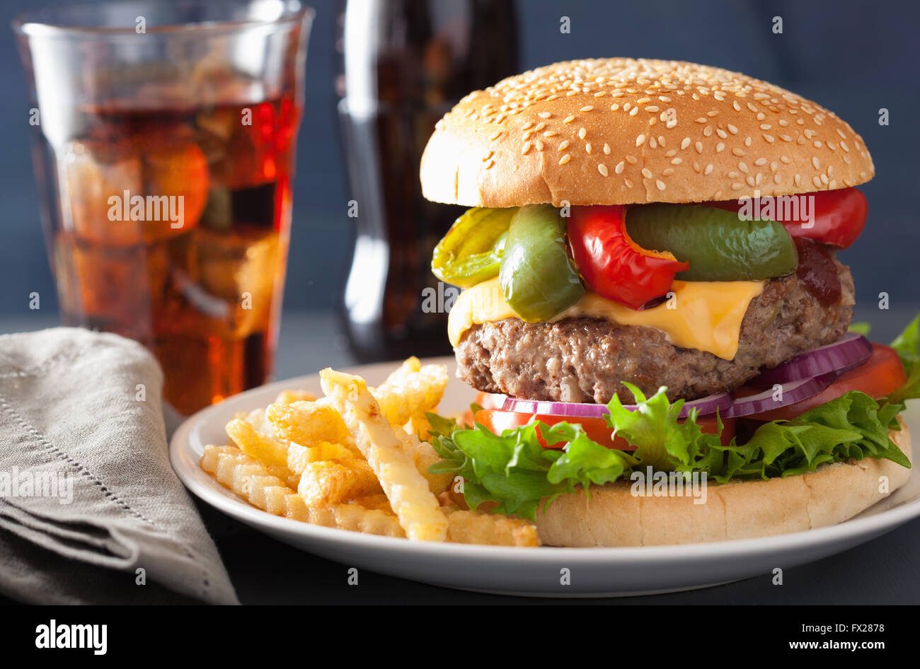 homemade cheese burger with peppers tomato onion Stock Photo - Alamy