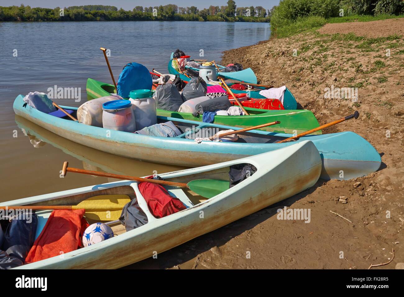 Canoes on the Riverside Stock Photo - Alamy