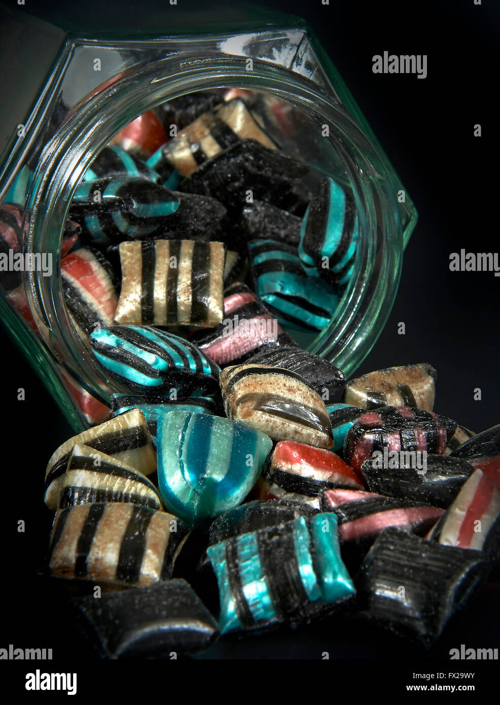 Colorful boiled sweets on a dark background Stock Photo - Alamy