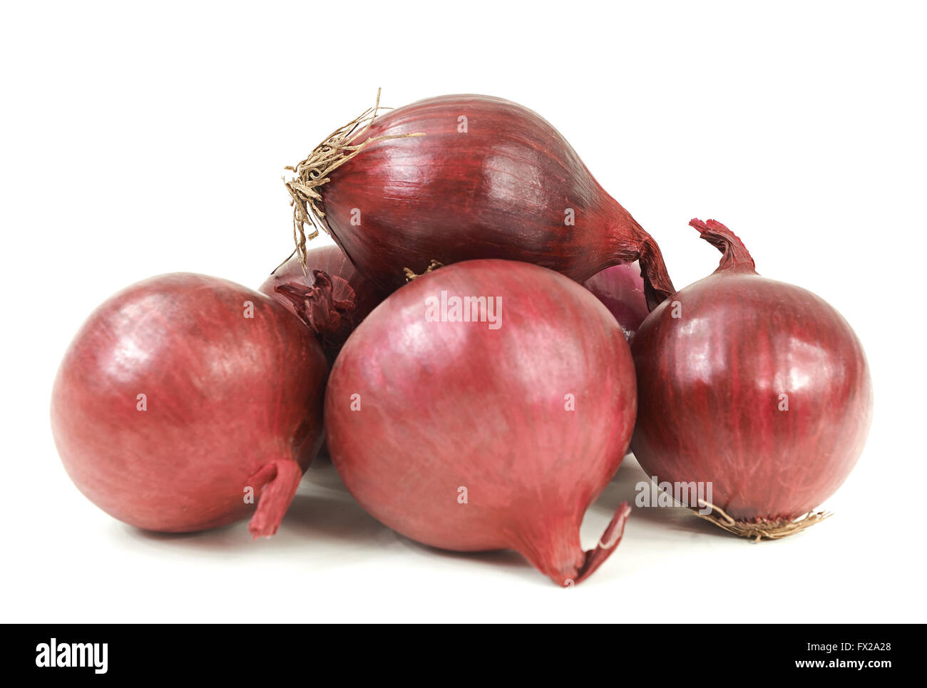 Red onions isolated on a white background Stock Photo - Alamy