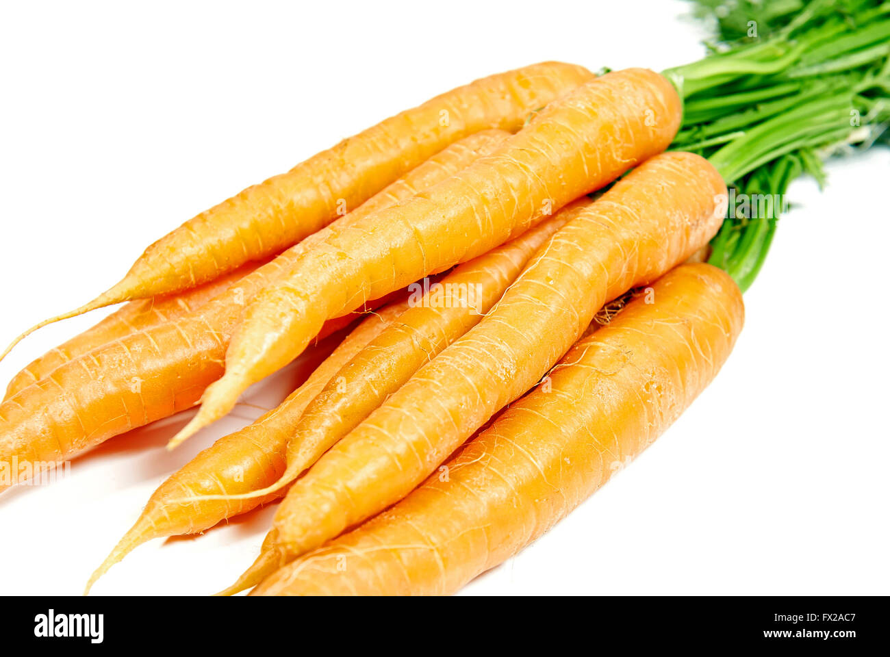 Raw fresh carrots isolated on white Stock Photo - Alamy