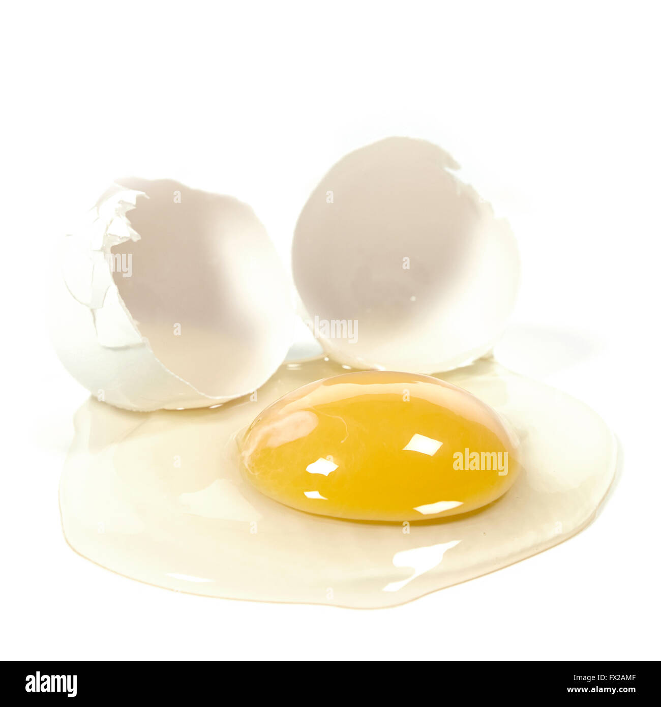 Broken egg isolated on a white background Stock Photo - Alamy