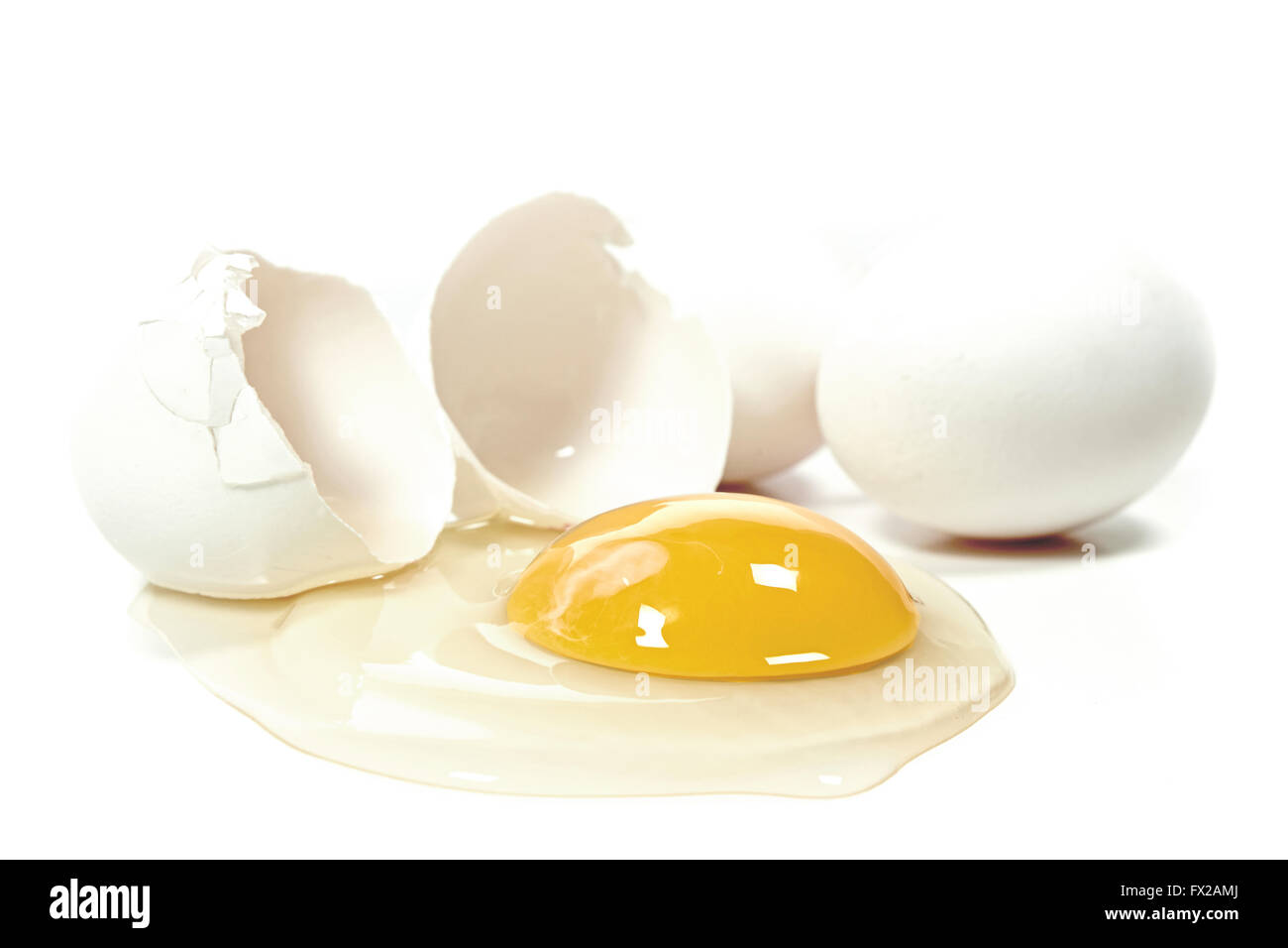 Broken egg isolated on a white background Stock Photo - Alamy