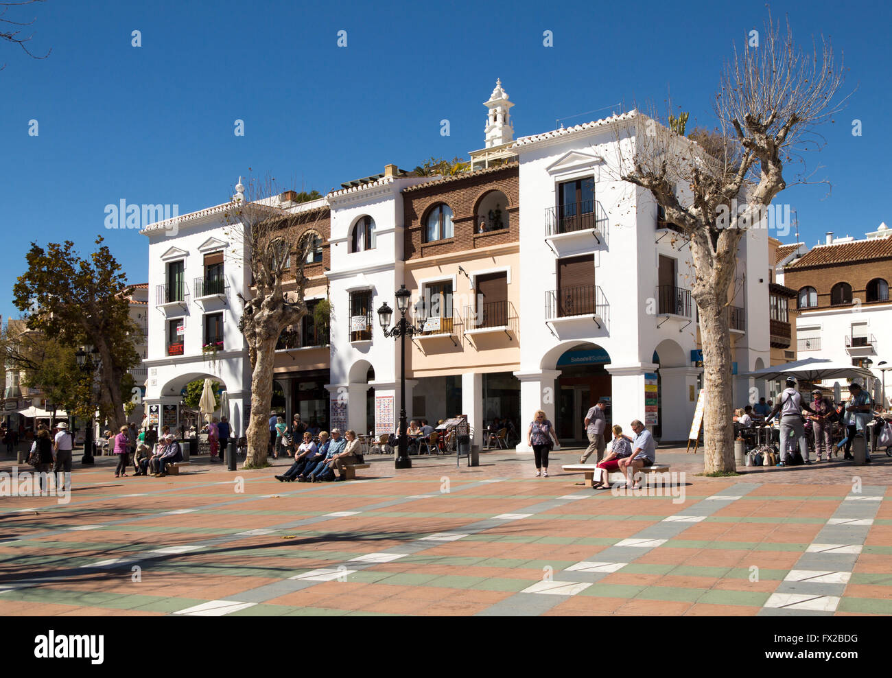 Town centre buildings in popular holiday resort town of Nerja, Malaga ...