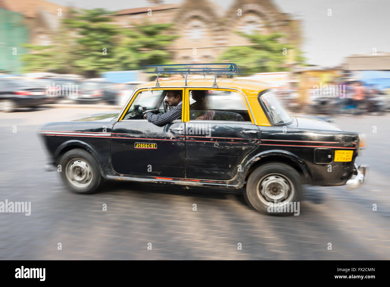 Mumbai taxi speeding through an intersection in South Mumbai Stock ...