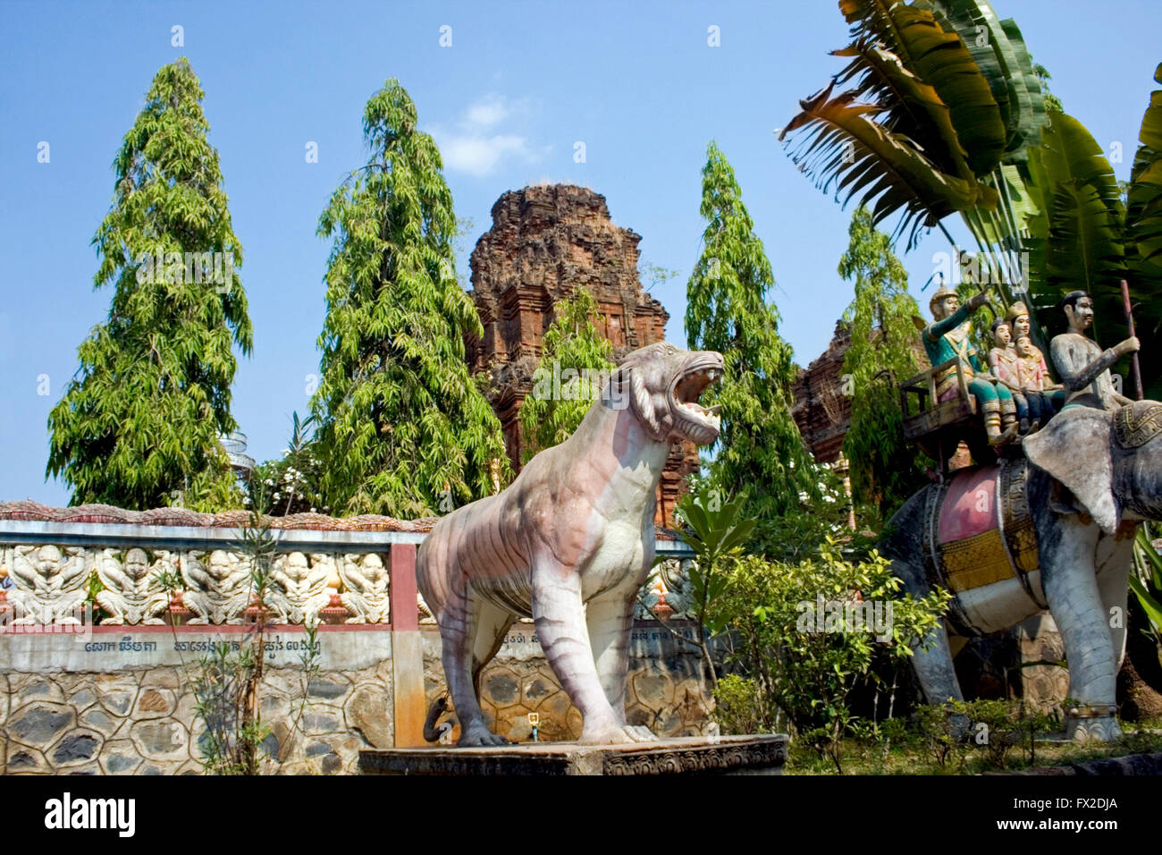 A tiger statue and an elephant statue carrying people are displayed at ...