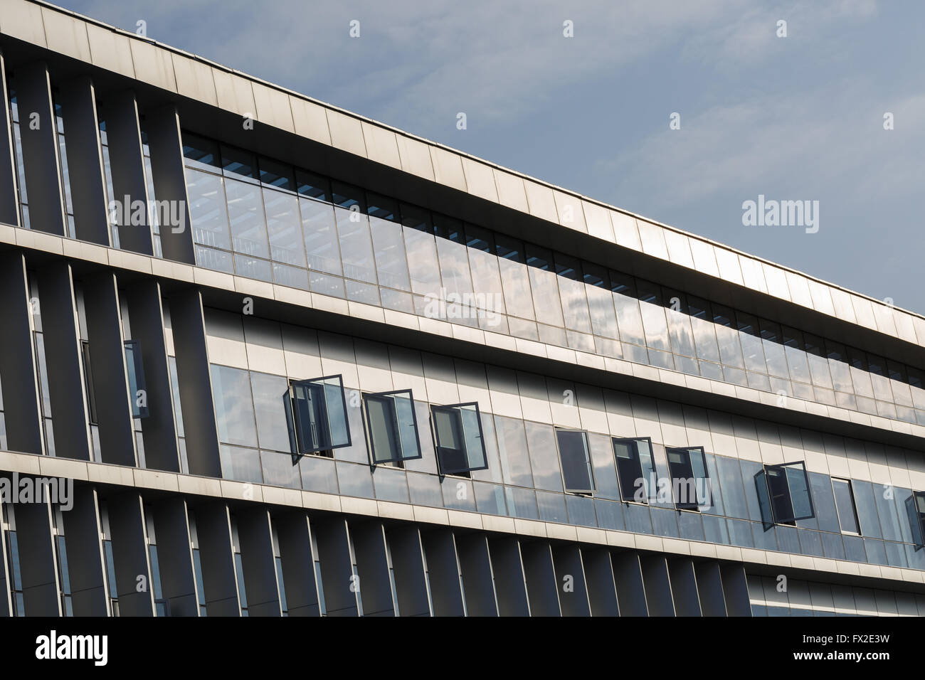 Blue glass curtain wall building local feature Stock Photo - Alamy