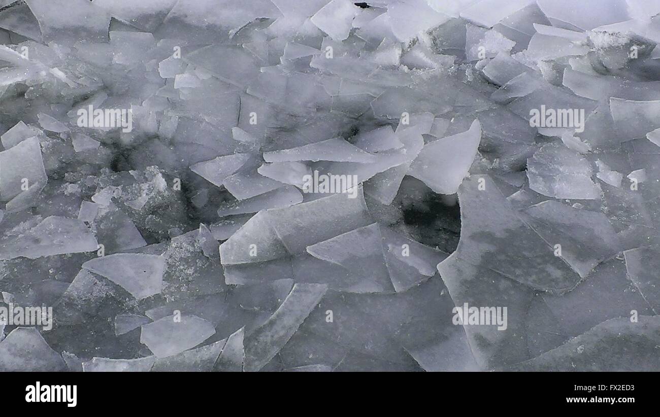 Large chunks of ice on the street Stock Photo - Alamy