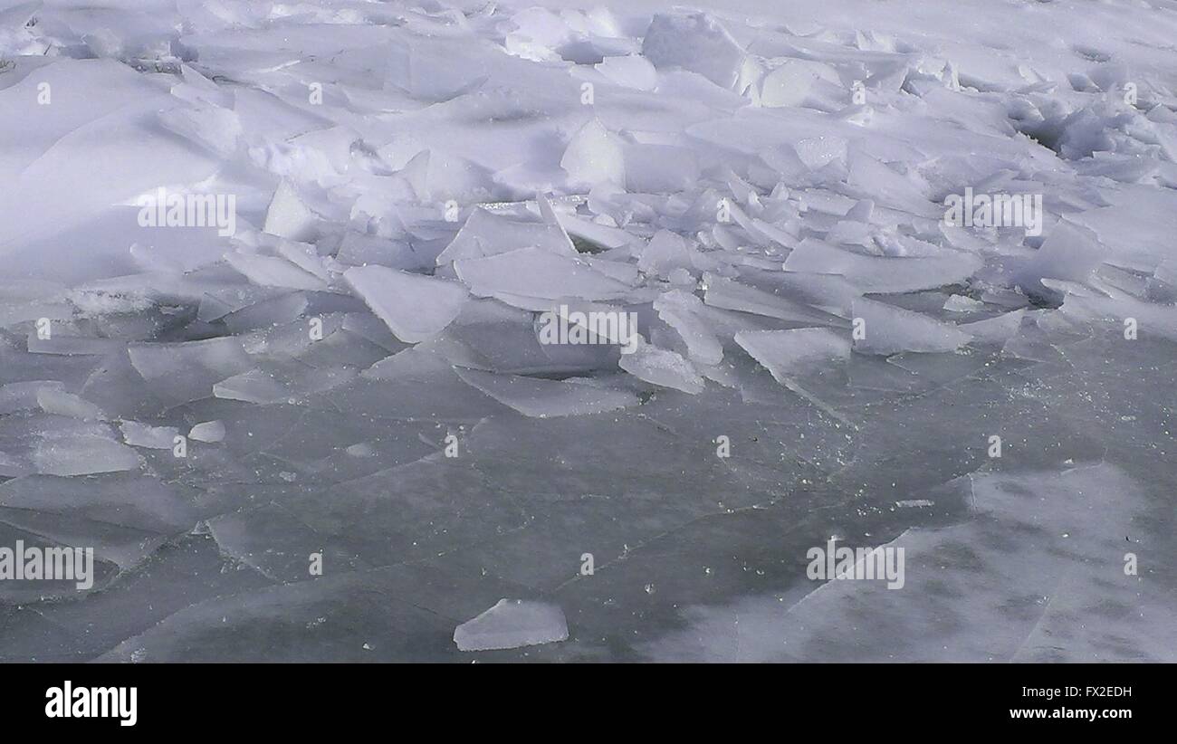 Large chunks of ice on the street Stock Photo - Alamy