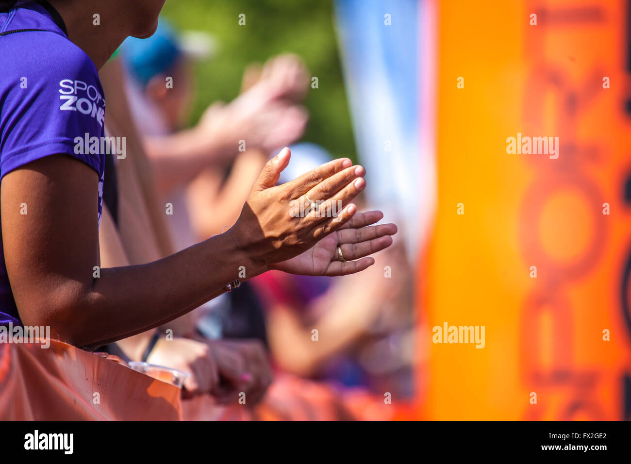 people clapping hands in a city marathon Stock Photo - Alamy