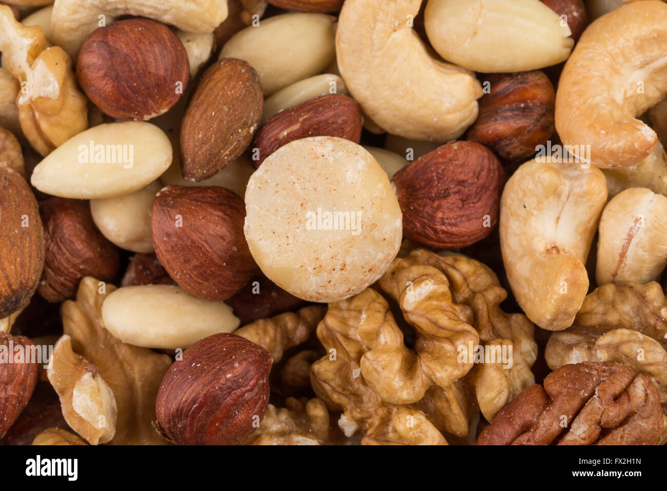 lot of different types of nuts mix for background Stock Photo - Alamy