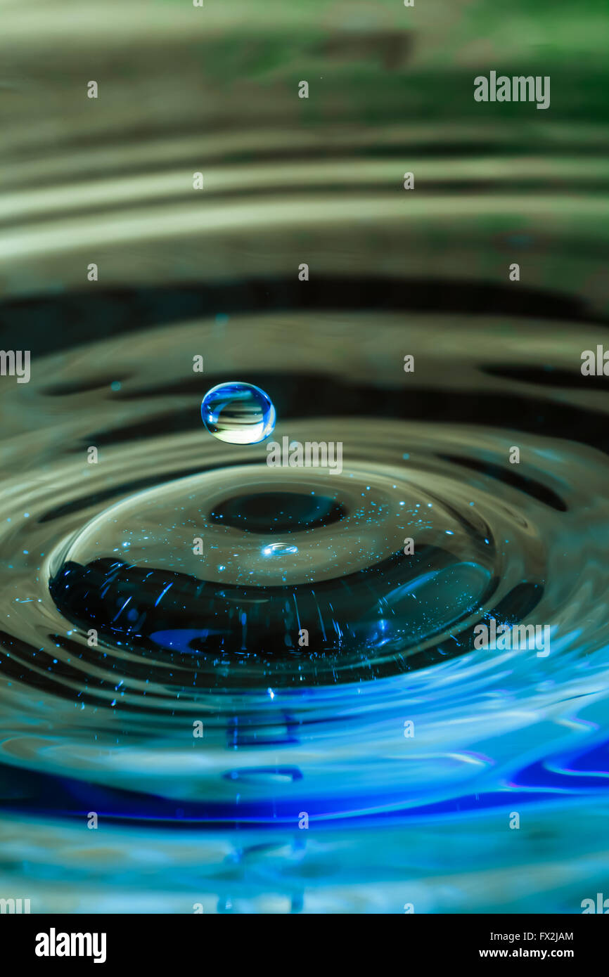 Beautiful colorful water splash from fallen drop Stock Photo - Alamy