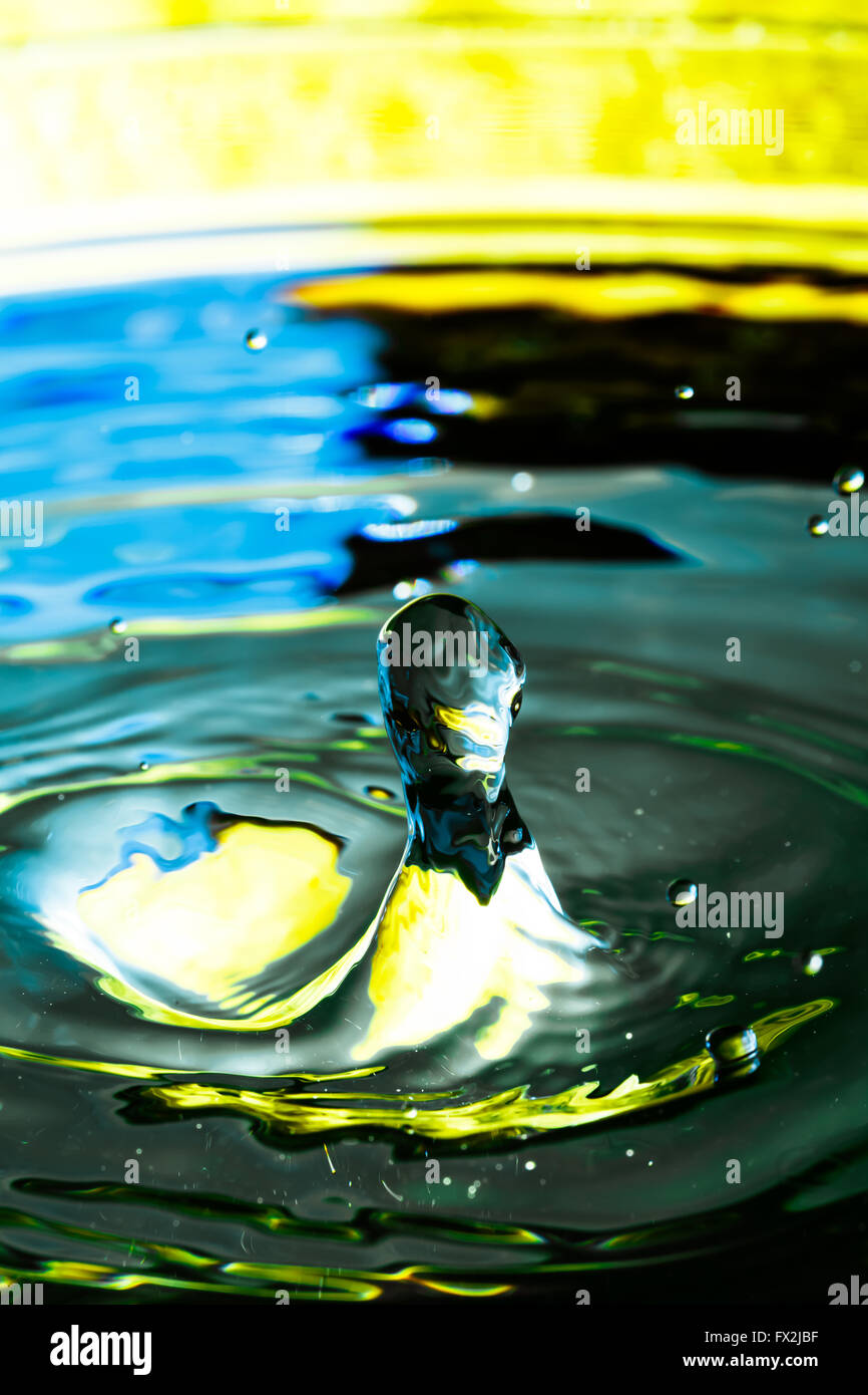 Beautiful colorful water splash from fallen drop Stock Photo - Alamy