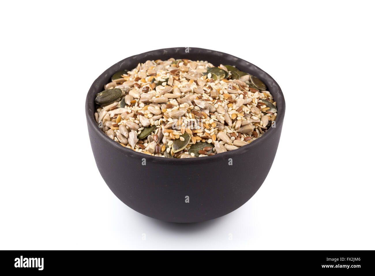 Healthy seeds mix in a stone bowl on white background Stock Photo - Alamy
