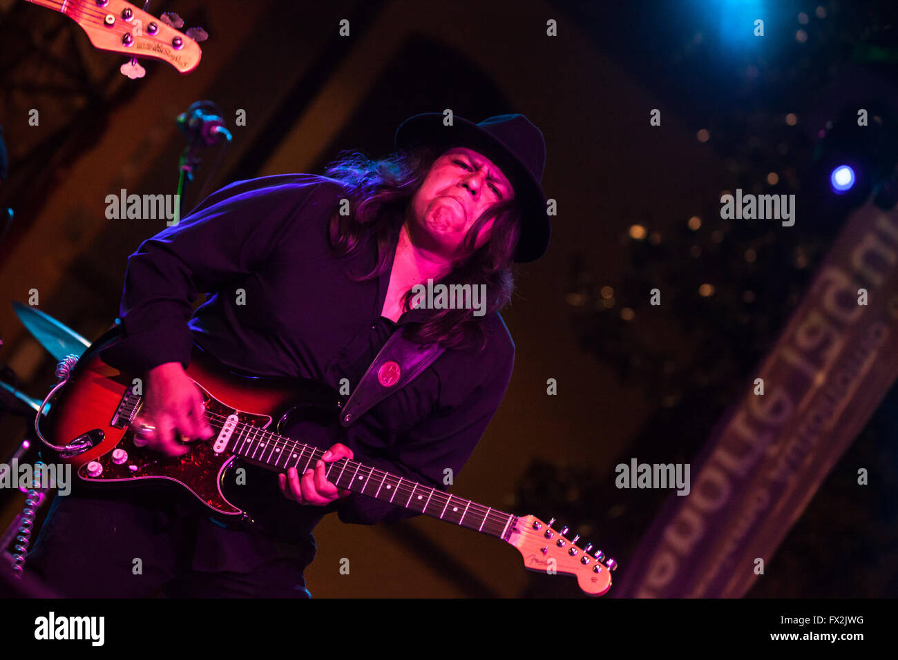 rock musician playing a Fender Stratocaster electric guitar during the ...