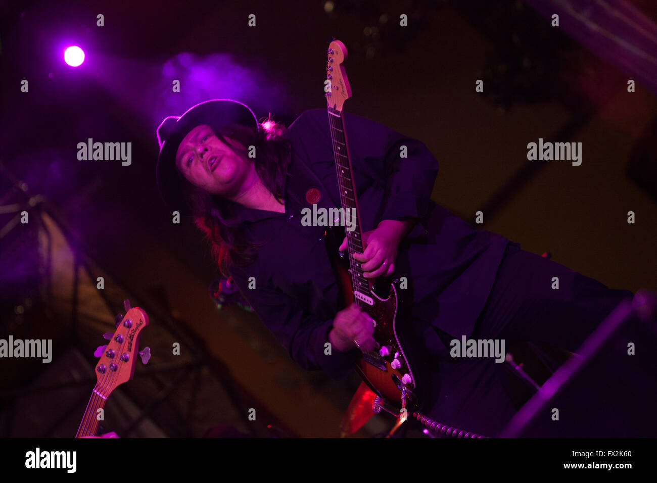 rock musician playing a Fender Stratocaster electric guitar during the ...