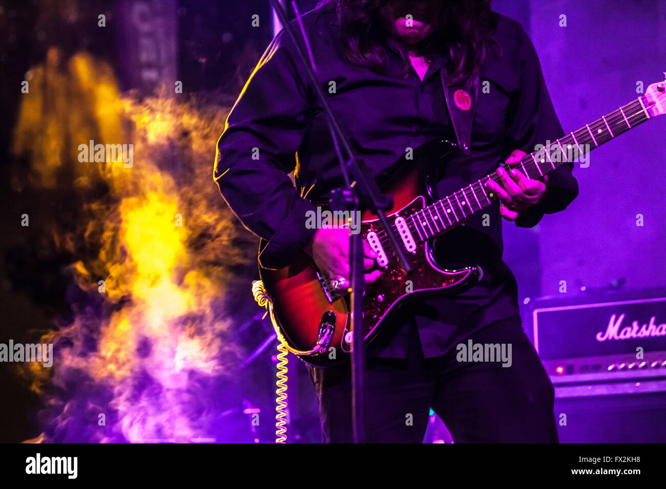 rock musician playing a Fender Stratocaster electric guitar during the ...