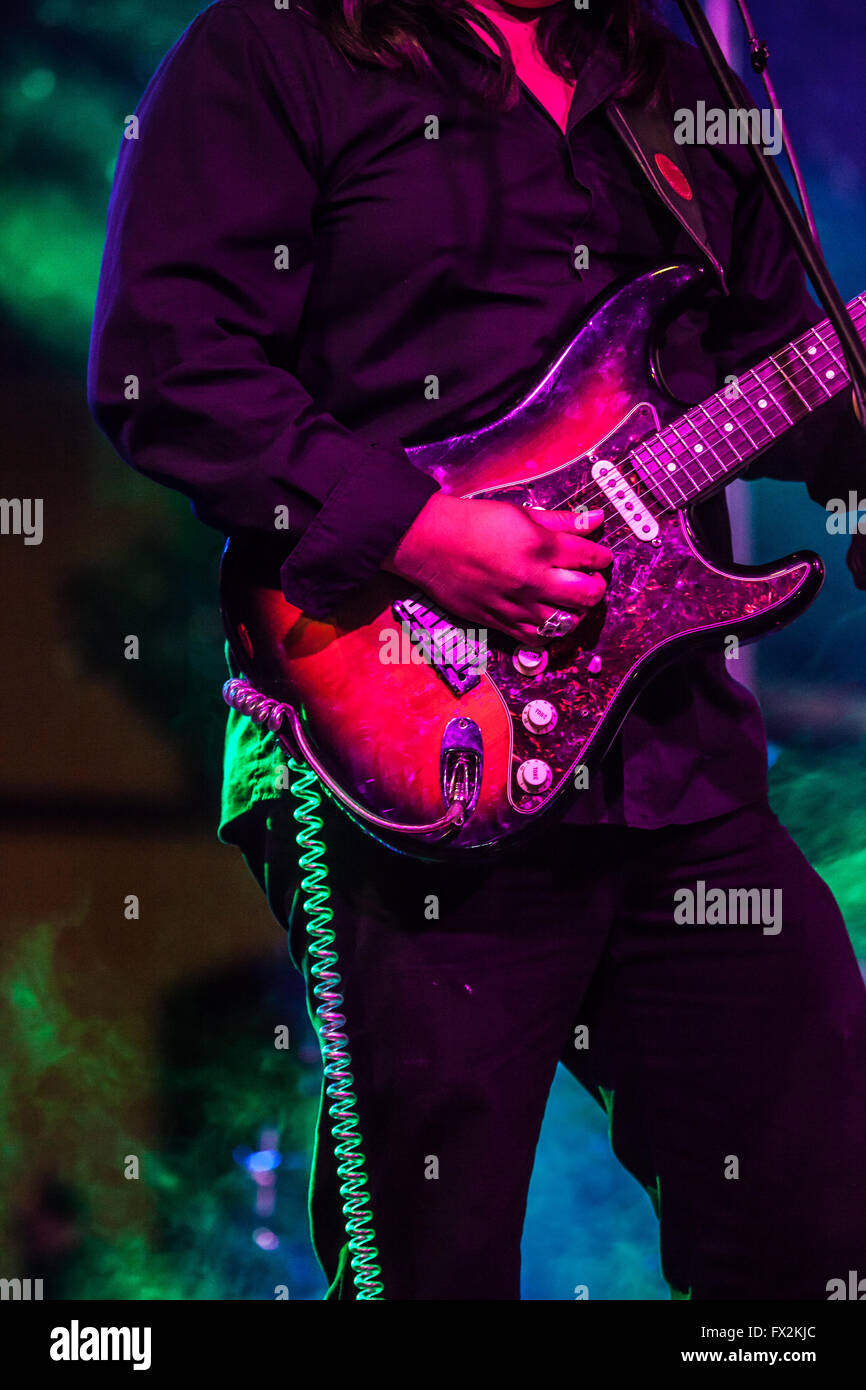 rock musician playing a Fender Stratocaster electric guitar during the ...