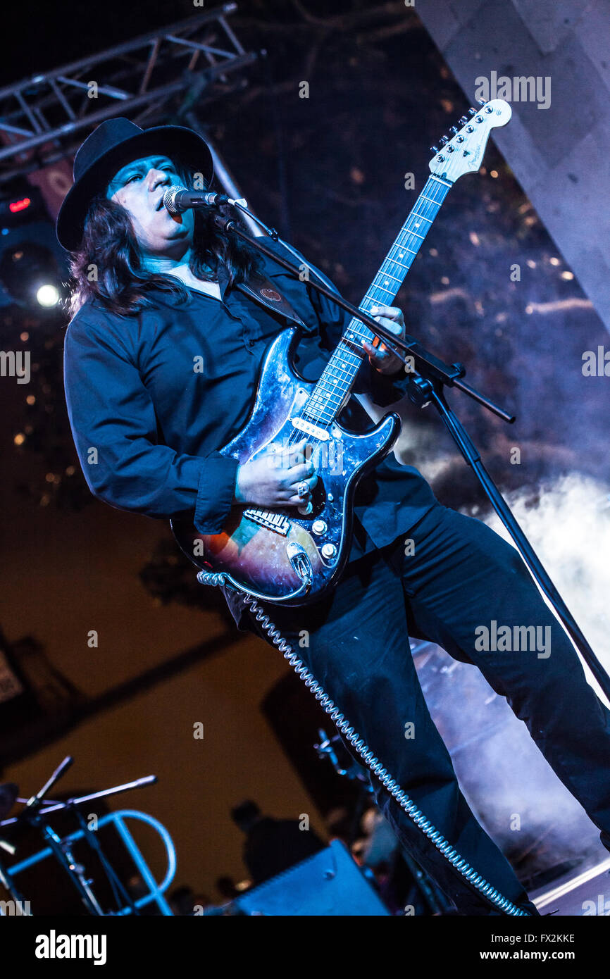 rock musician playing a Fender Stratocaster electric guitar during the ...
