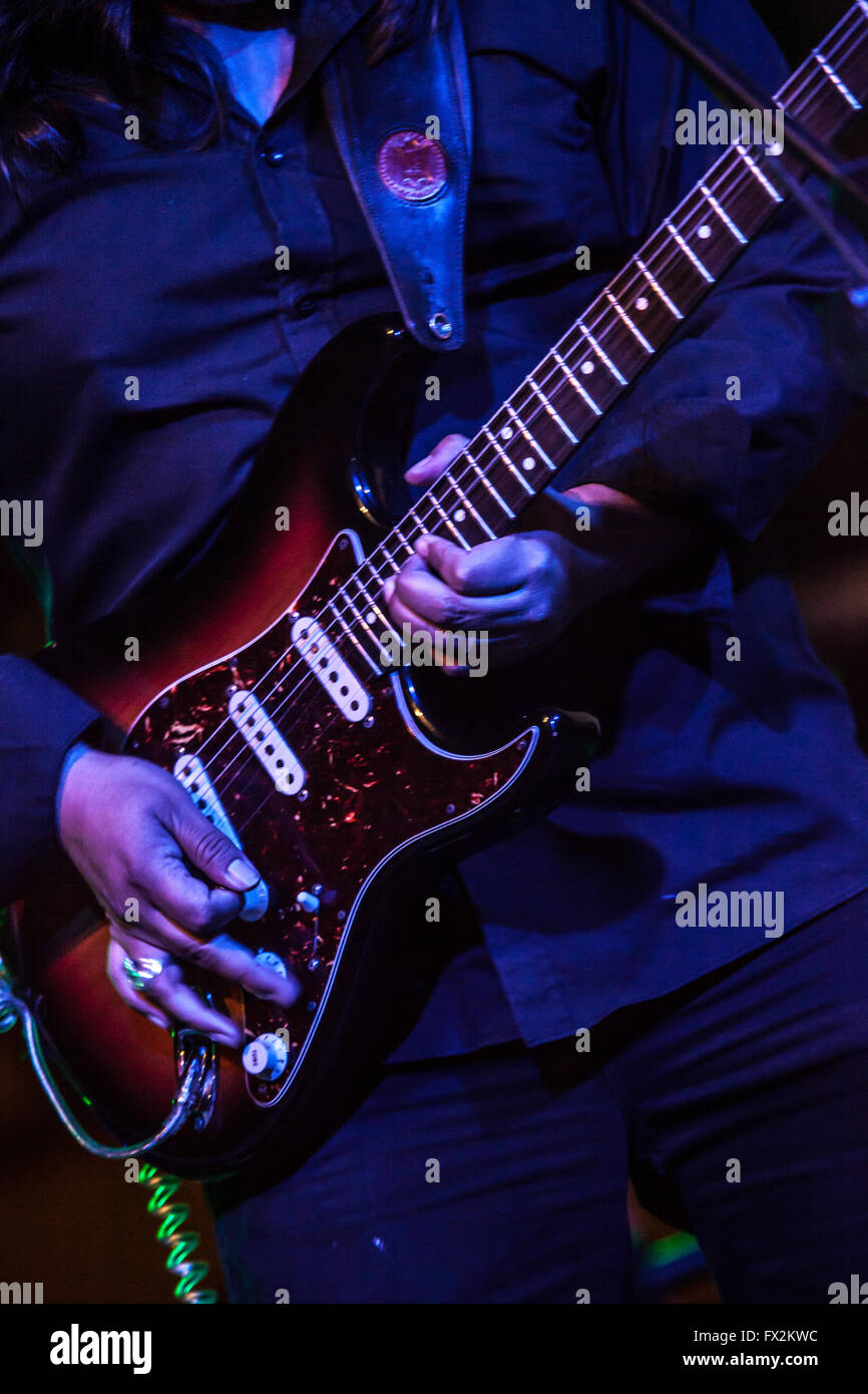 rock musician playing a Fender Stratocaster electric guitar during the ...