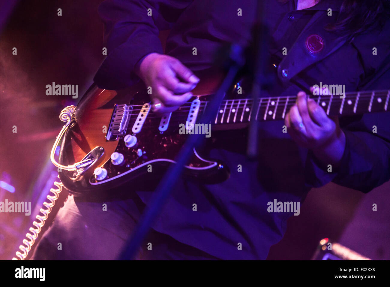 rock musician playing a Fender Stratocaster electric guitar during the ...