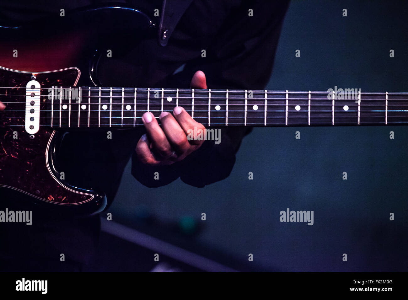 rock musician playing a Fender Stratocaster electric guitar during the ...