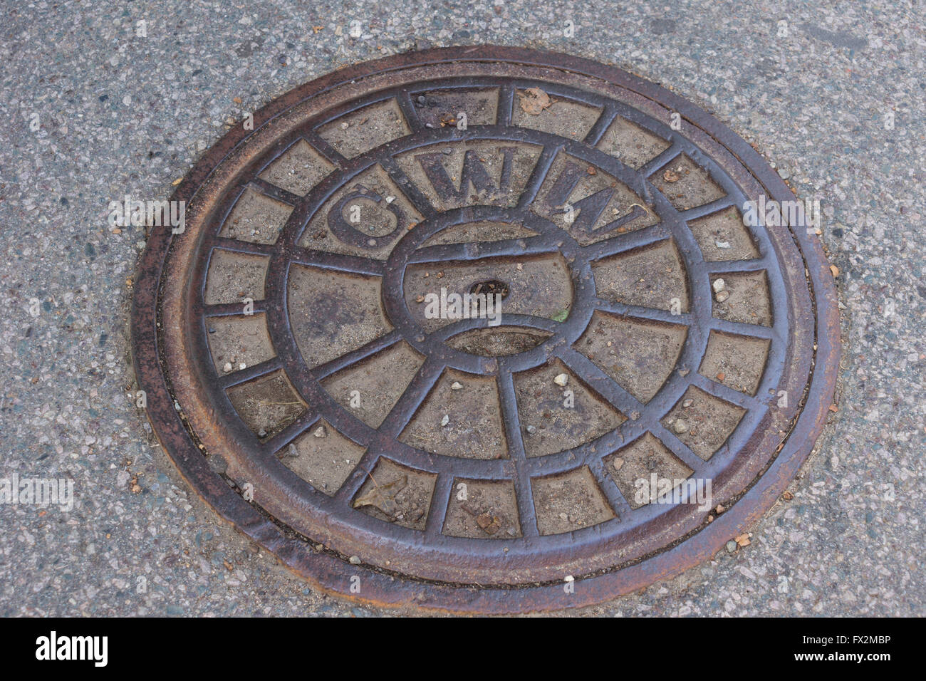 Metal manhole cover in the USA marked 'CWW' Stock Photo - Alamy