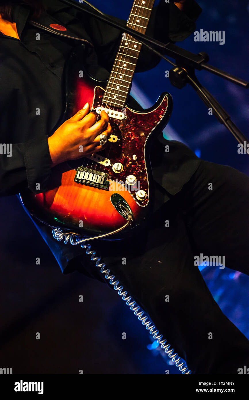 rock musician playing a Fender Stratocaster electric guitar during the ...