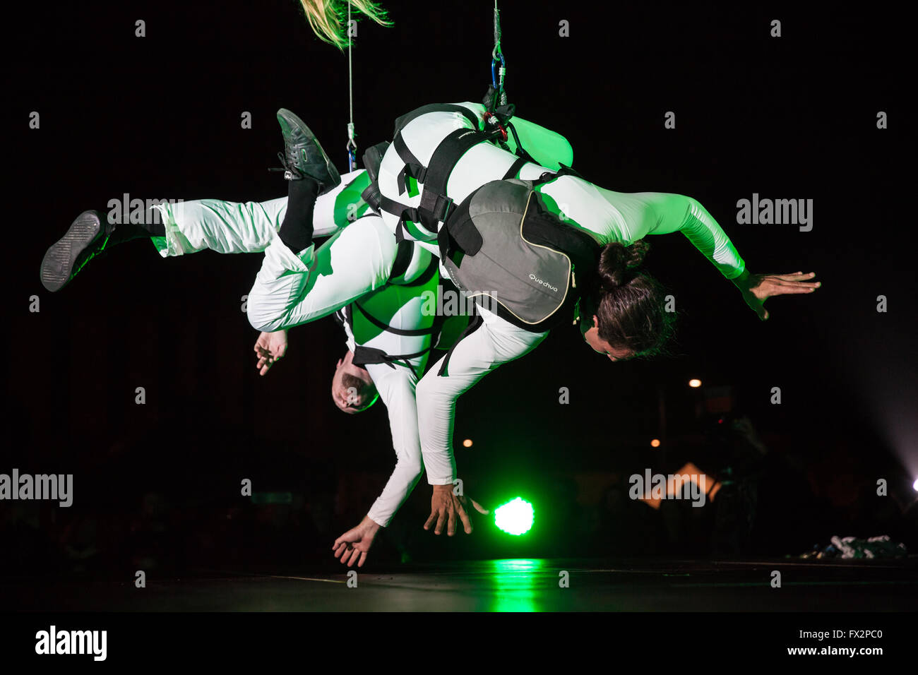 acrobats hanging in the open air at night during the LA NOCHE EN BLANCO ...